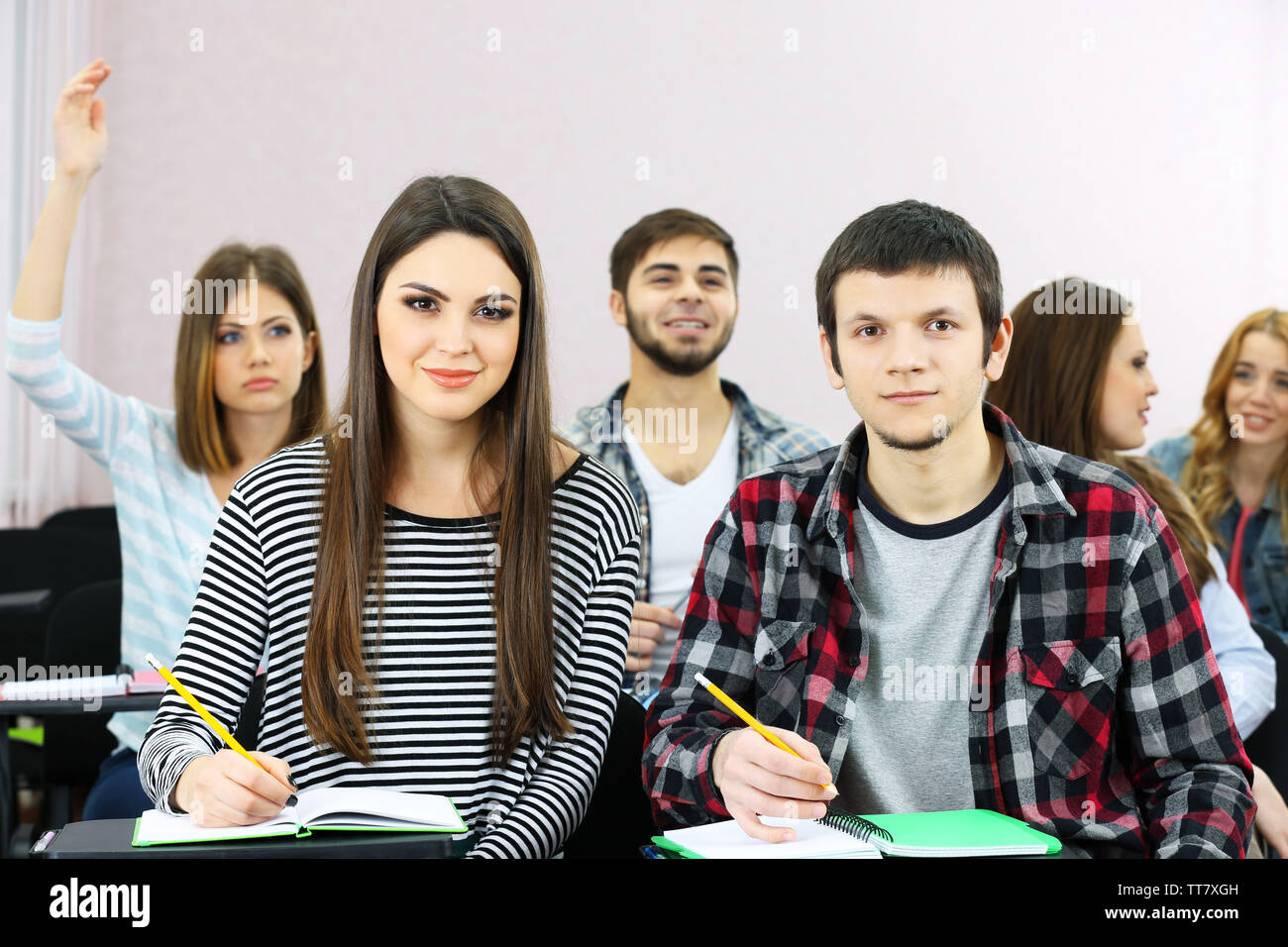 Group of students sitting in classroom Stock Photo - Alamy