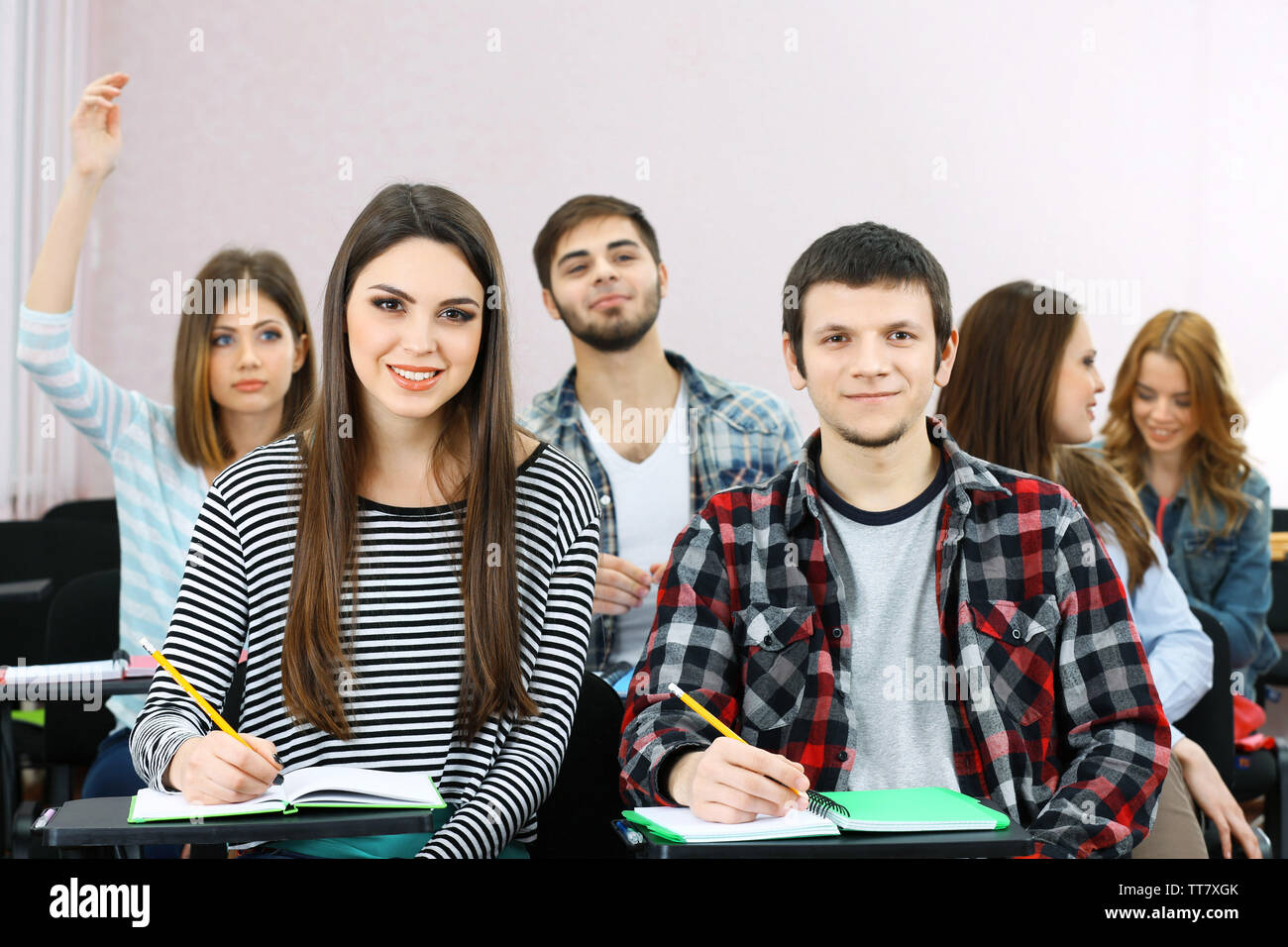 Group of students sitting in classroom Stock Photo - Alamy
