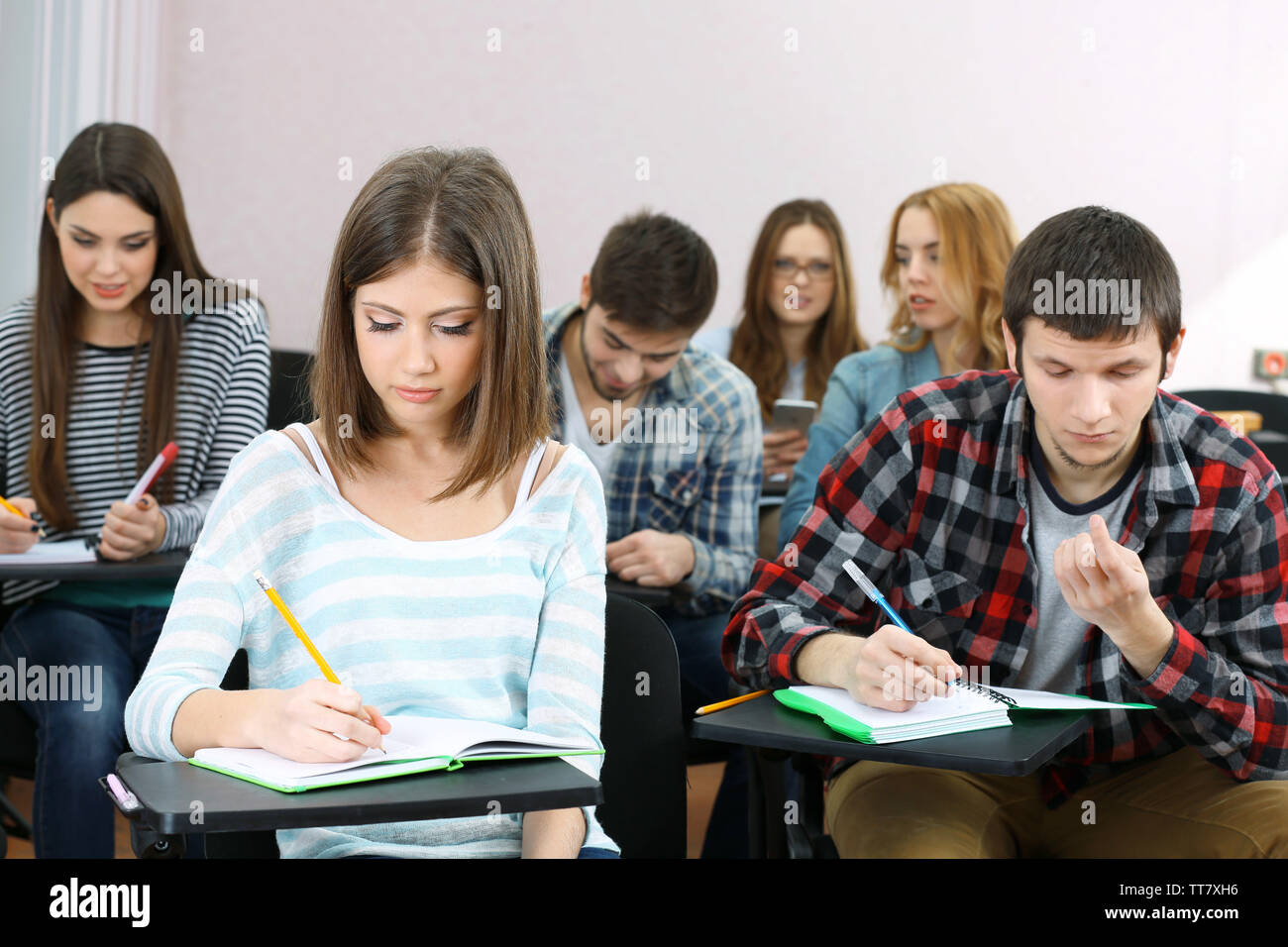 Group of students sitting in classroom Stock Photo - Alamy