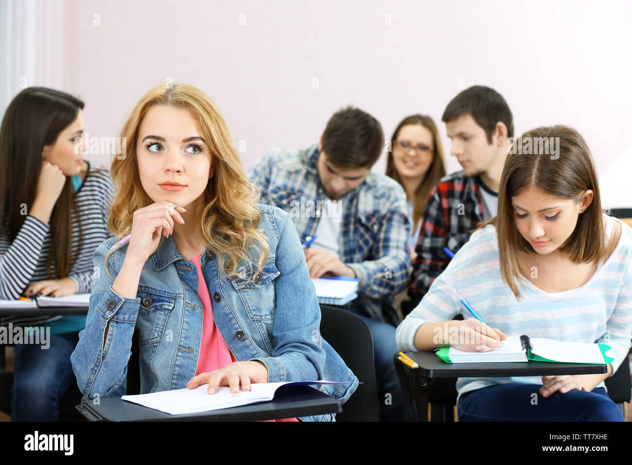 Group of students sitting in classroom Stock Photo - Alamy