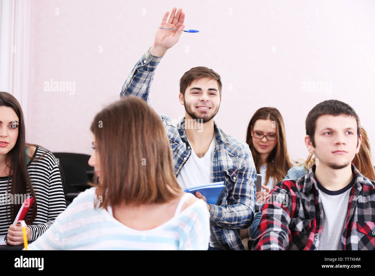 Group of students sitting in classroom Stock Photo - Alamy
