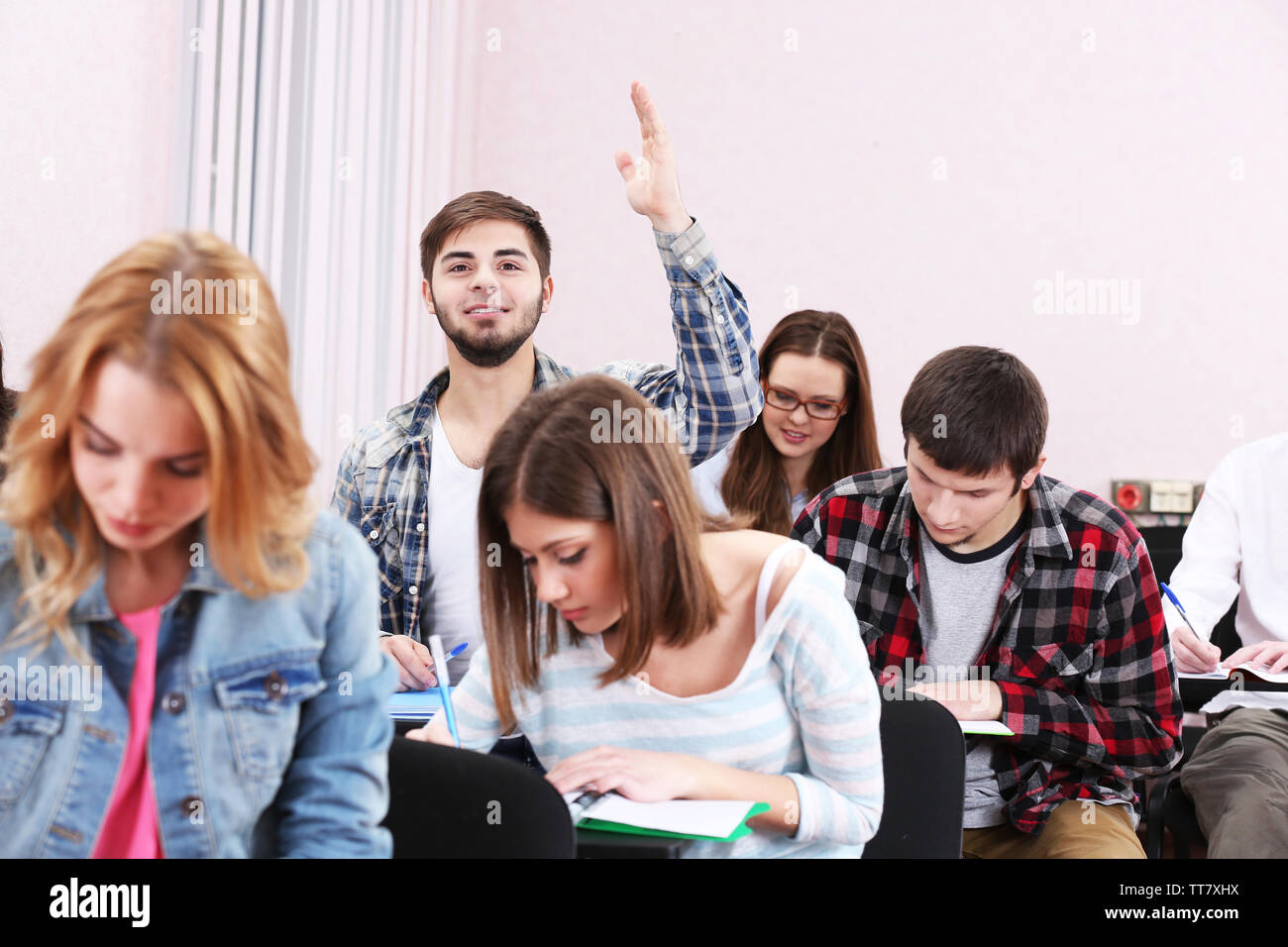 Group of students sitting in classroom Stock Photo - Alamy