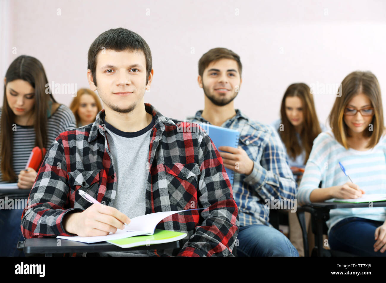 Group of students sitting in classroom Stock Photo - Alamy