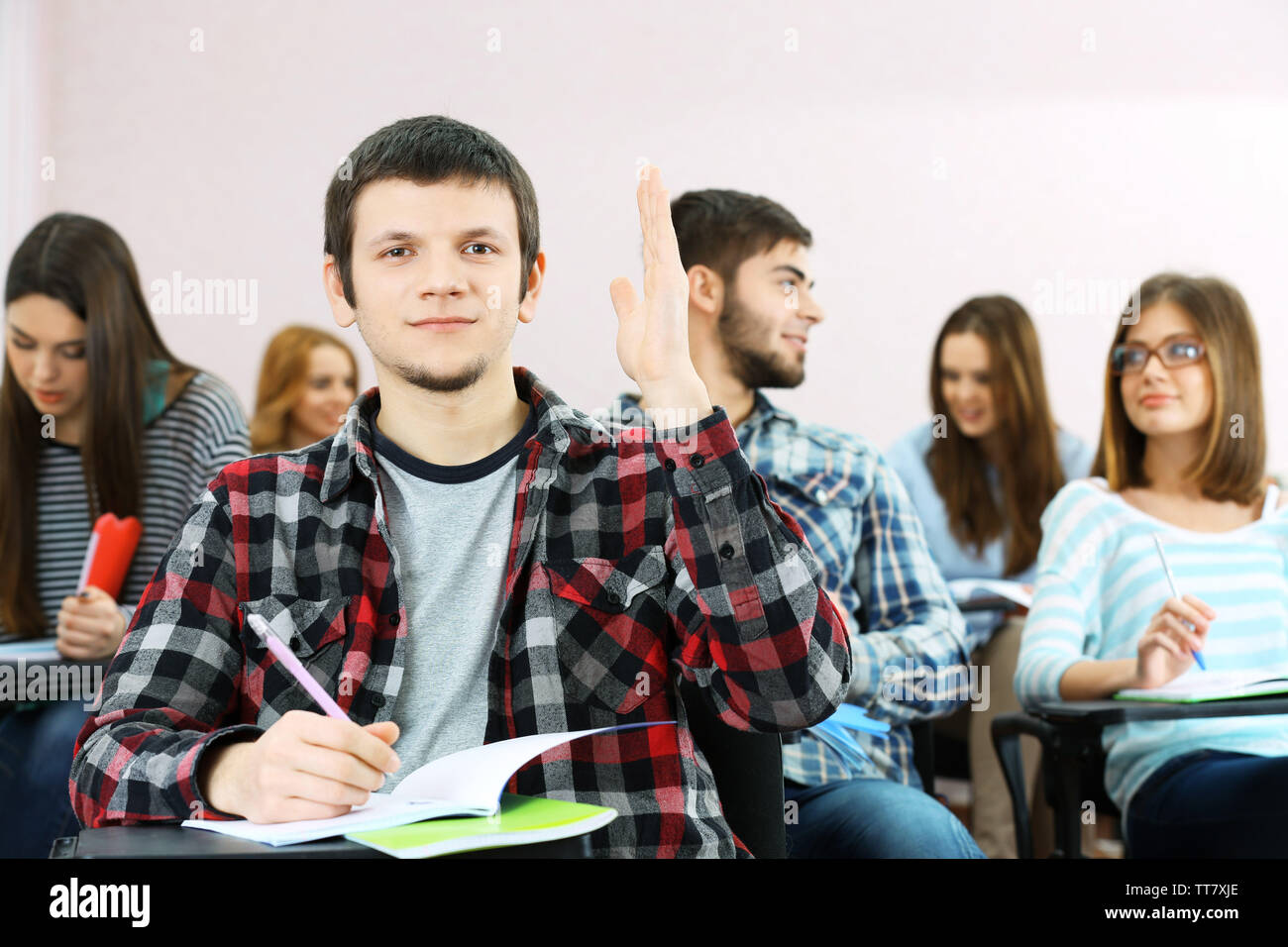 Group of students sitting in classroom Stock Photo - Alamy