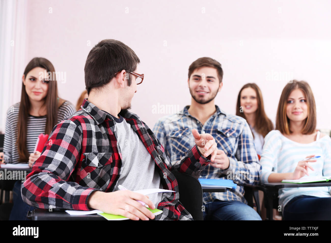 Group of students sitting in classroom Stock Photo - Alamy