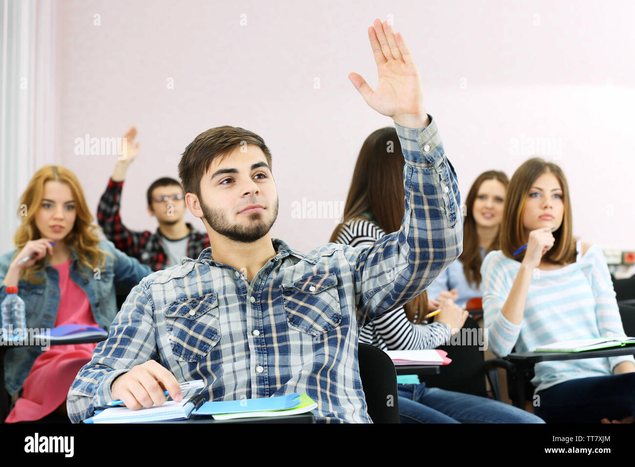 Group of students sitting in classroom Stock Photo - Alamy