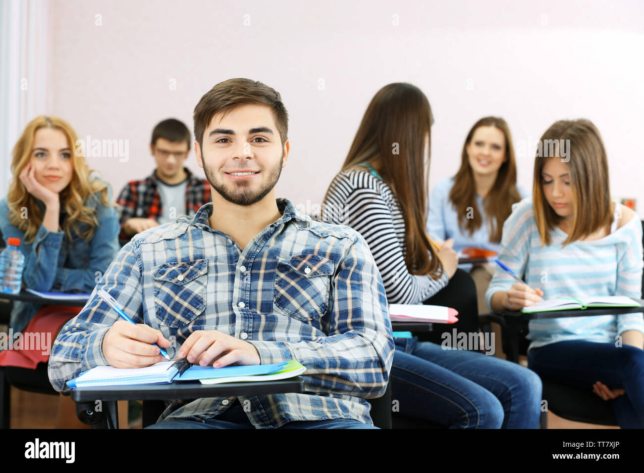 Group of students sitting in classroom Stock Photo - Alamy