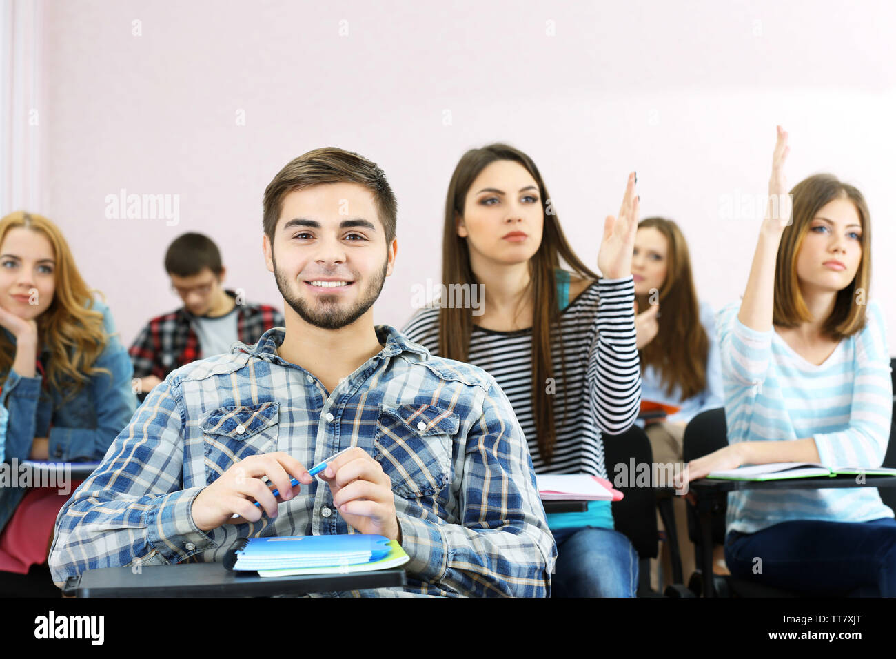 Group of students sitting in classroom Stock Photo - Alamy