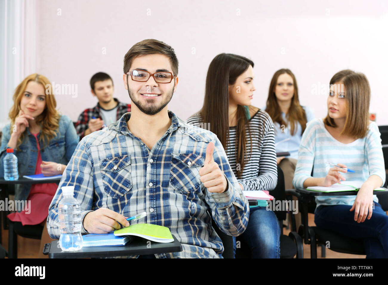 Group of students sitting in classroom Stock Photo - Alamy