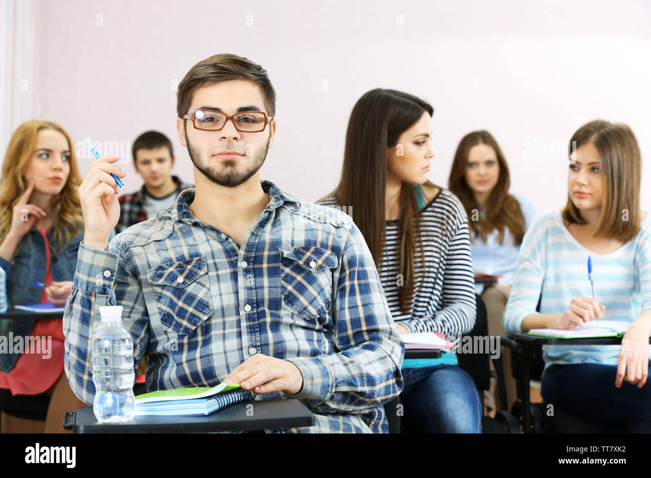Group of students sitting in classroom Stock Photo - Alamy