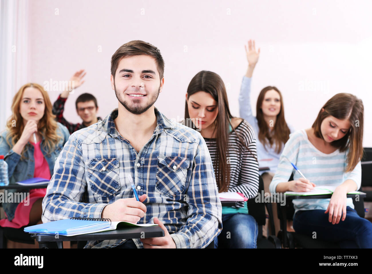 Group of students sitting in classroom Stock Photo - Alamy