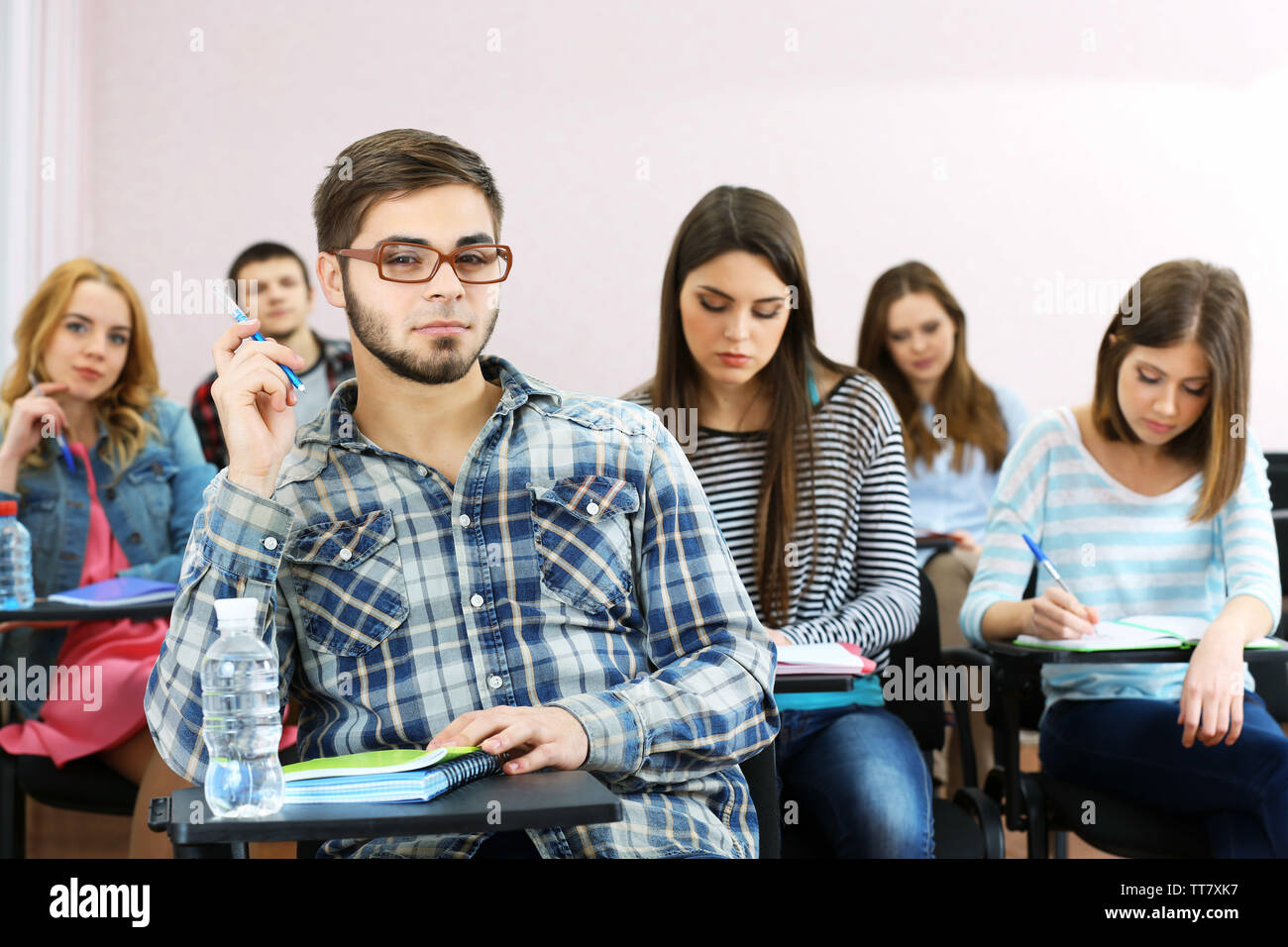 Group of students sitting in classroom Stock Photo - Alamy