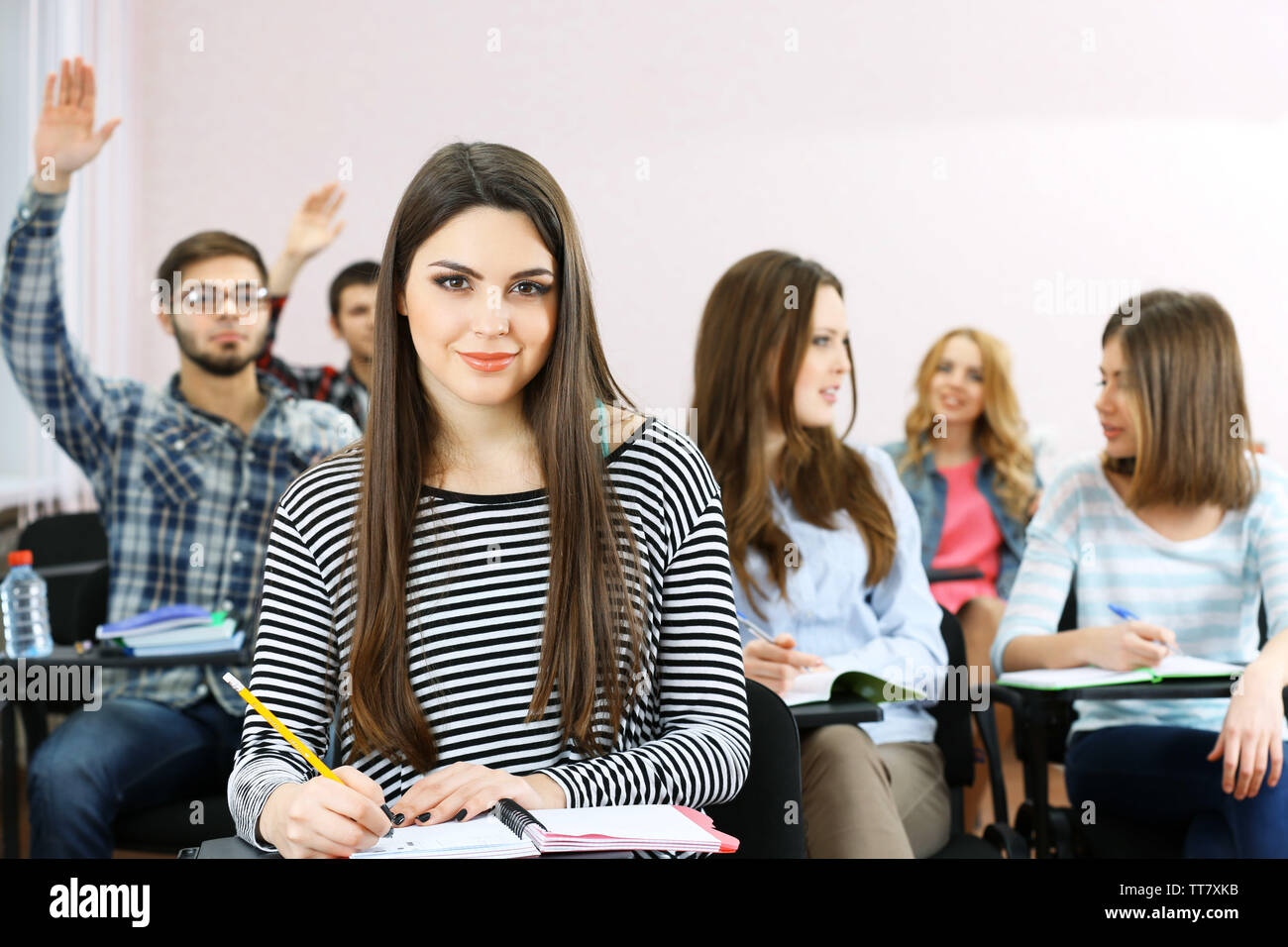 Group of students sitting in classroom Stock Photo - Alamy