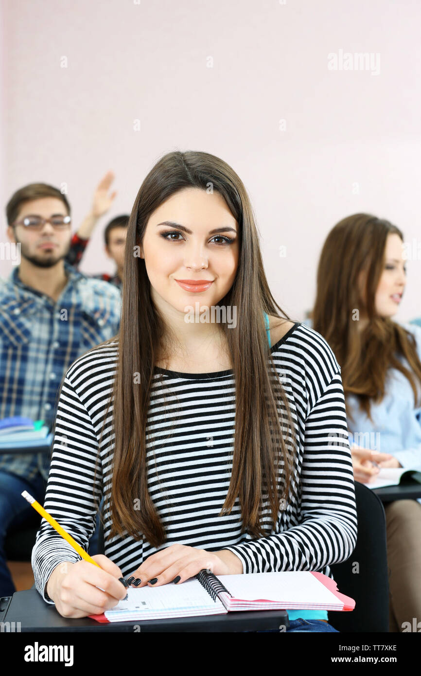 Group of students sitting in classroom Stock Photo - Alamy