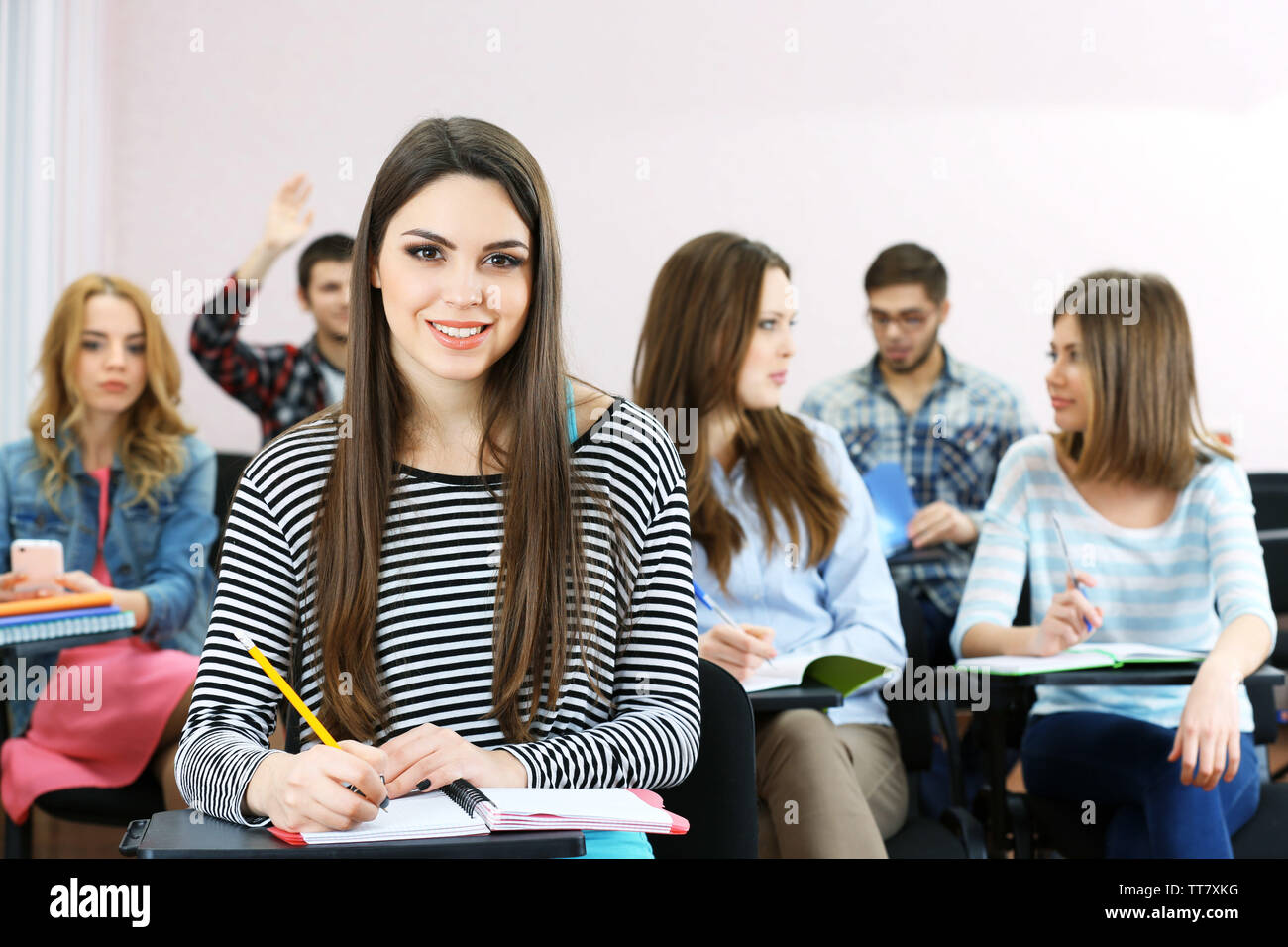Group of students sitting in classroom Stock Photo - Alamy