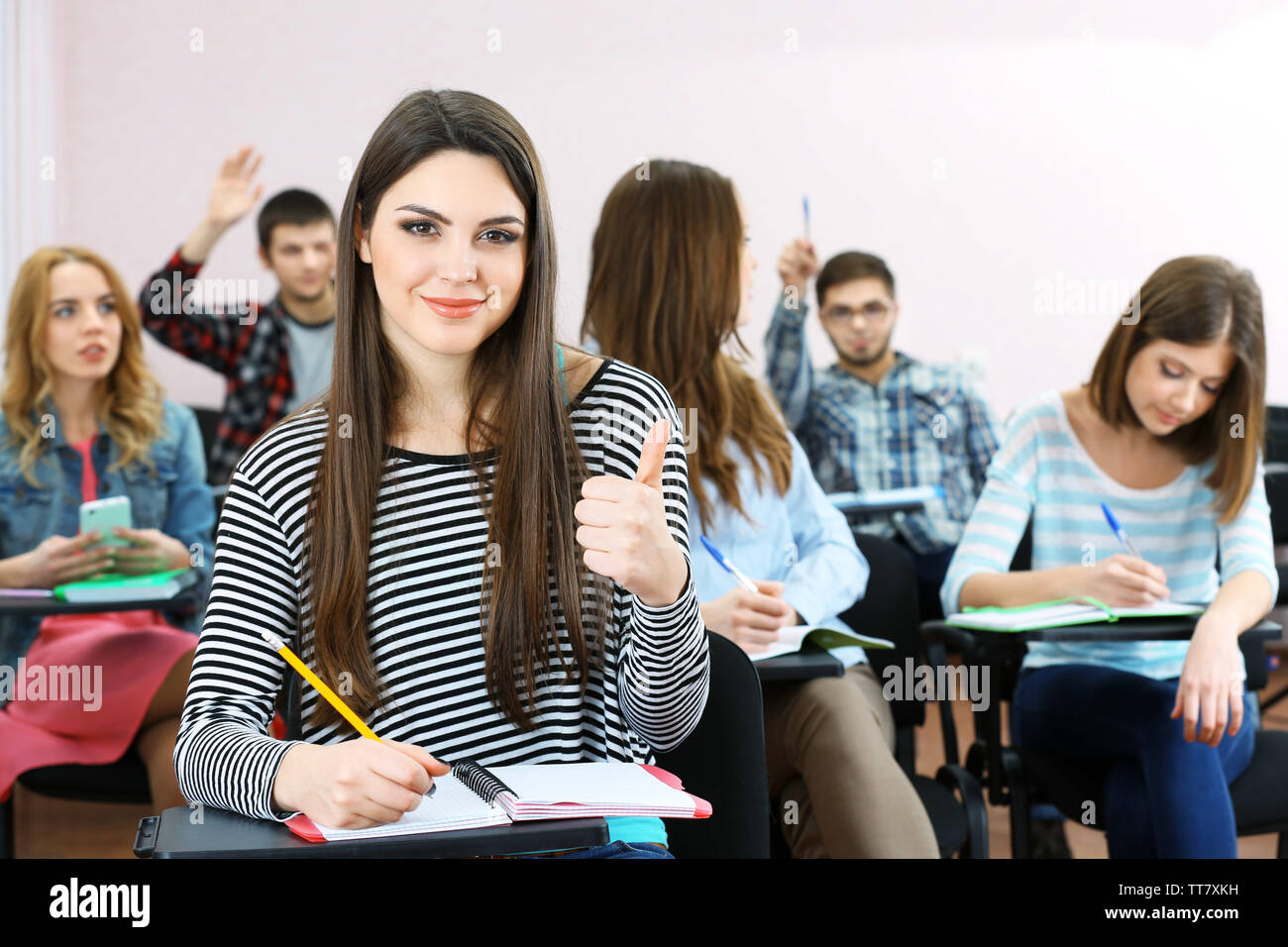 Group of students sitting in classroom Stock Photo - Alamy