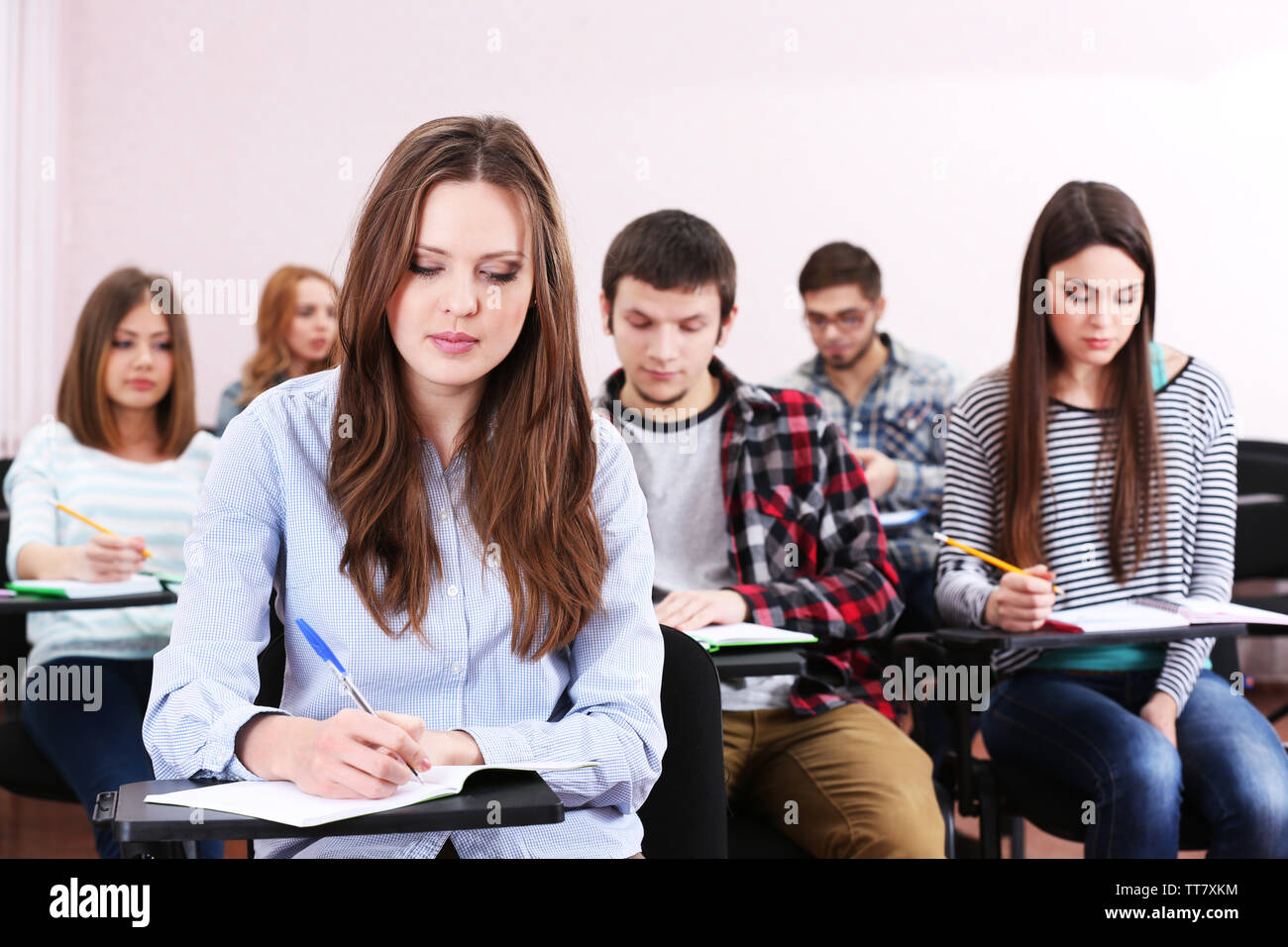 Group of students sitting in classroom Stock Photo - Alamy