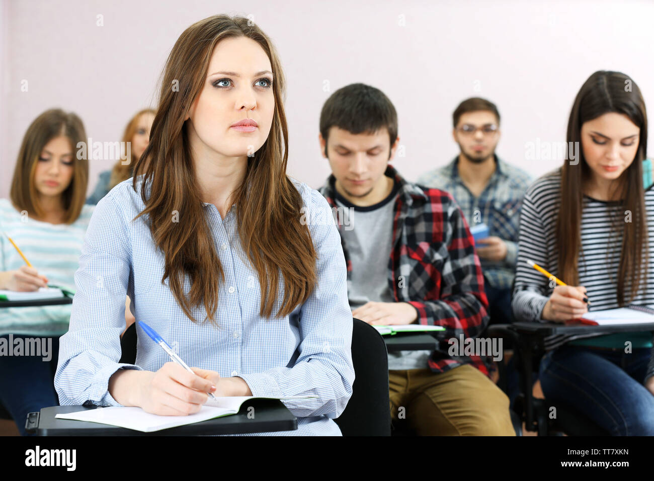 Group of students sitting in classroom Stock Photo - Alamy