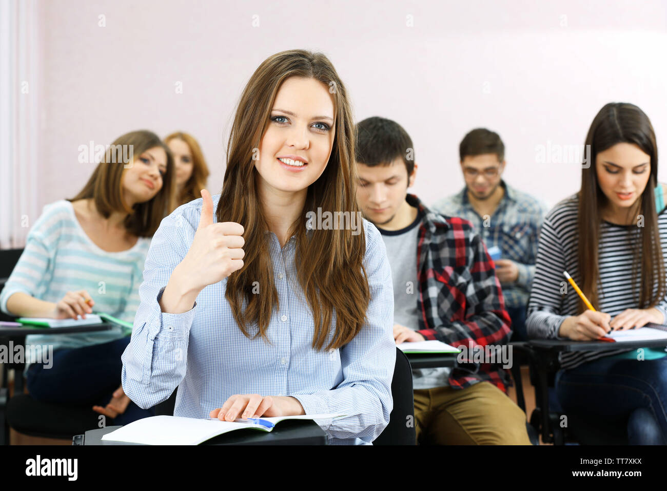 Group of students sitting in classroom Stock Photo - Alamy