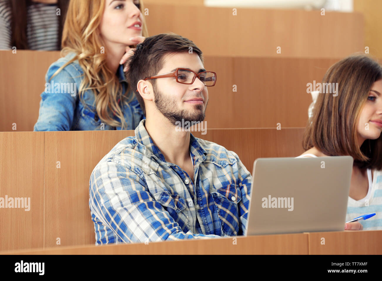 Group of students sitting in classroom Stock Photo - Alamy