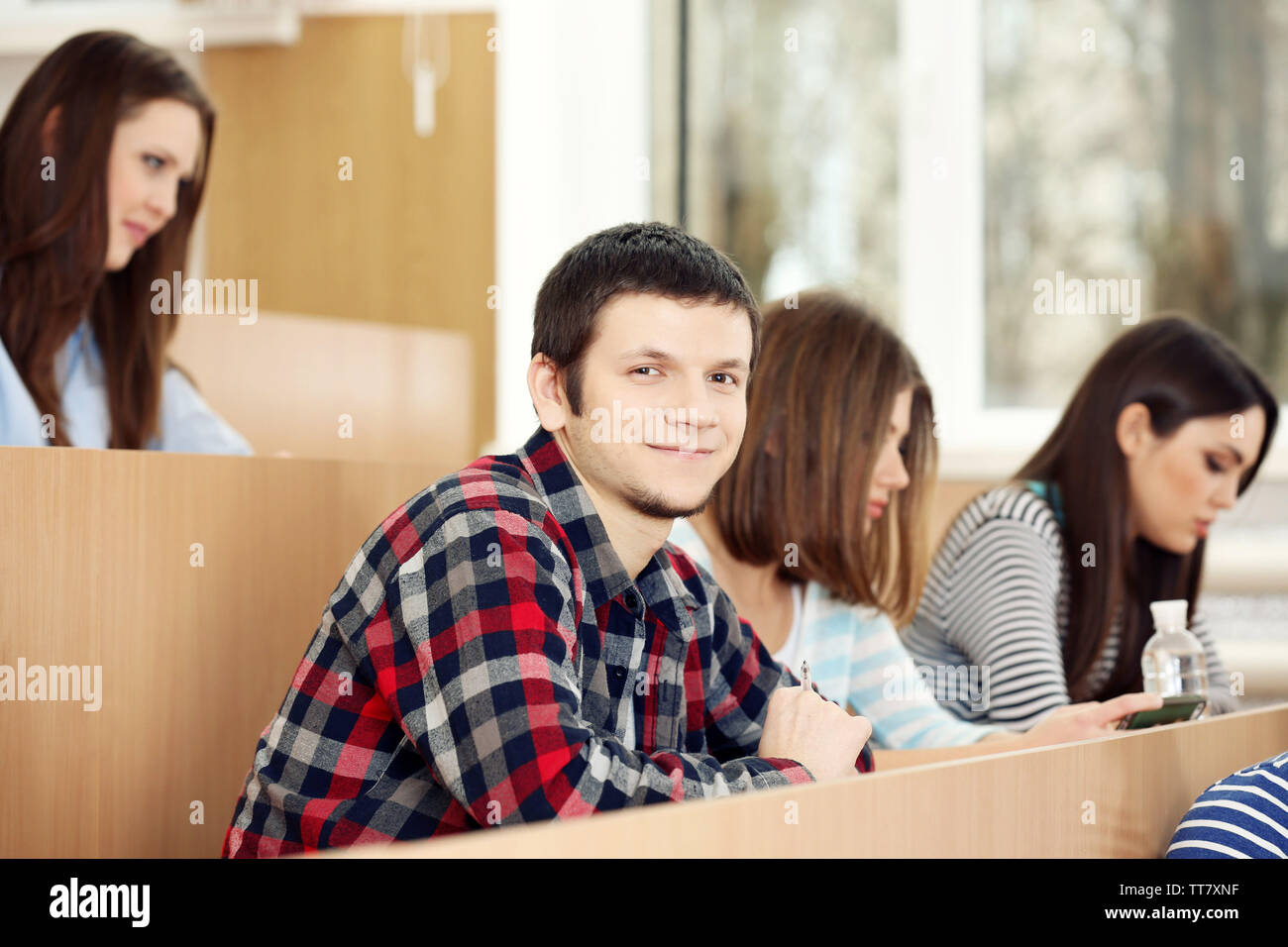 Group of students sitting in classroom Stock Photo - Alamy