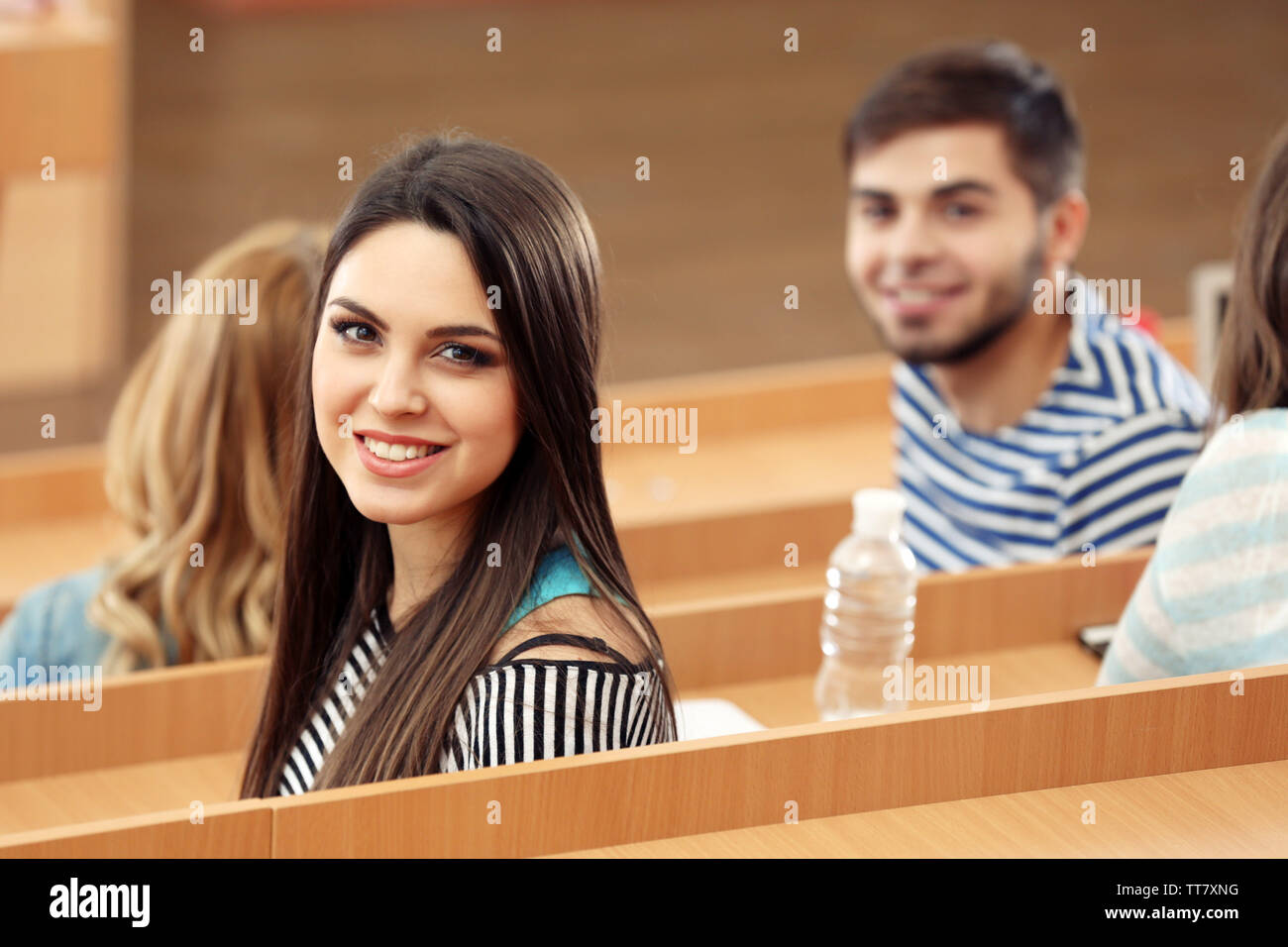 Group of students sitting in classroom Stock Photo - Alamy