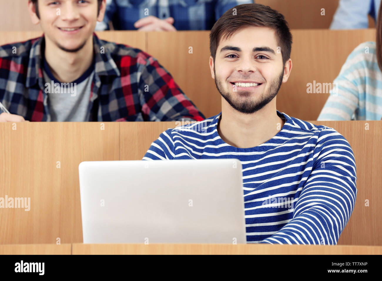 Group of students sitting in classroom Stock Photo - Alamy