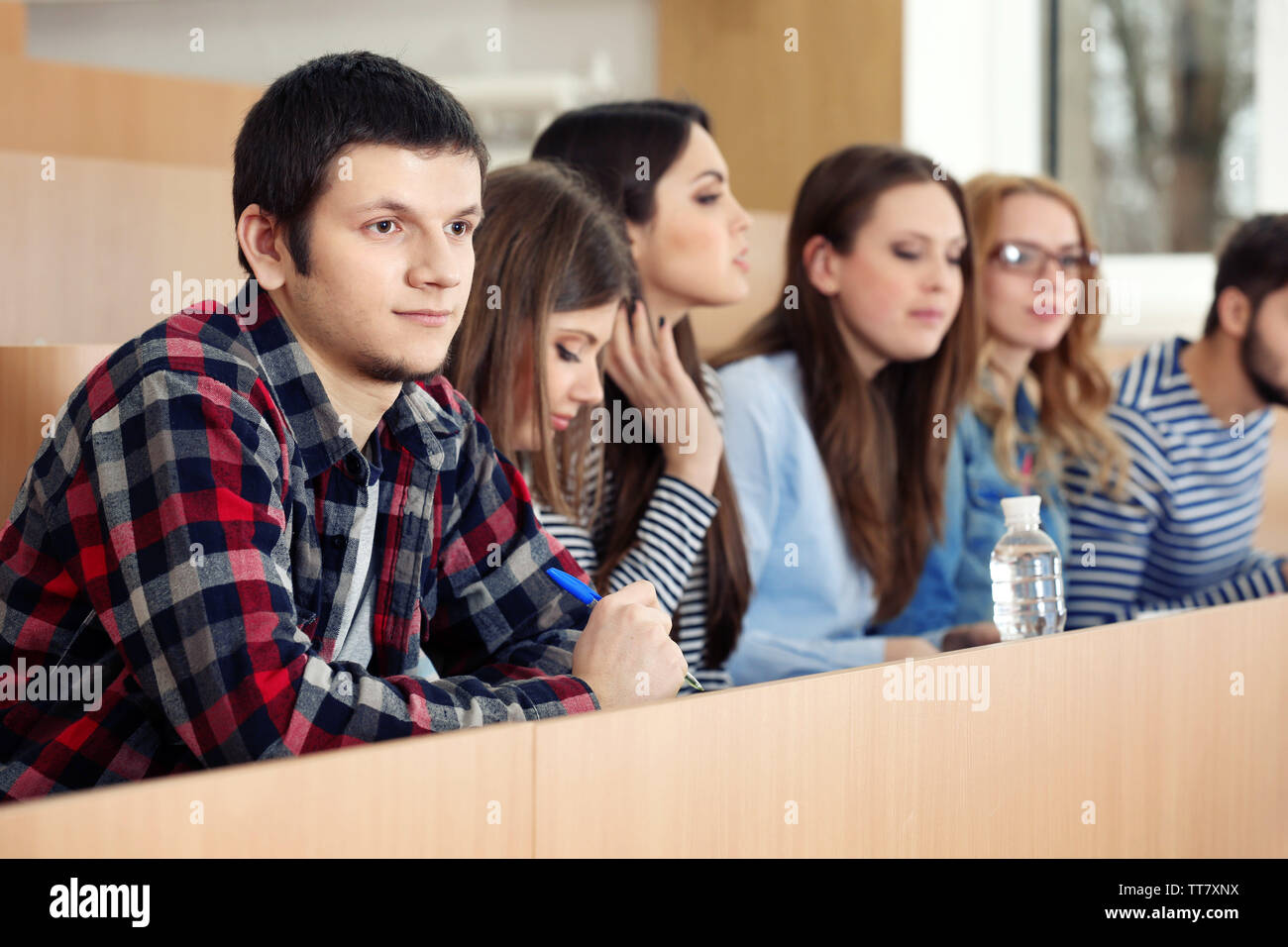 Group of students sitting in classroom Stock Photo - Alamy