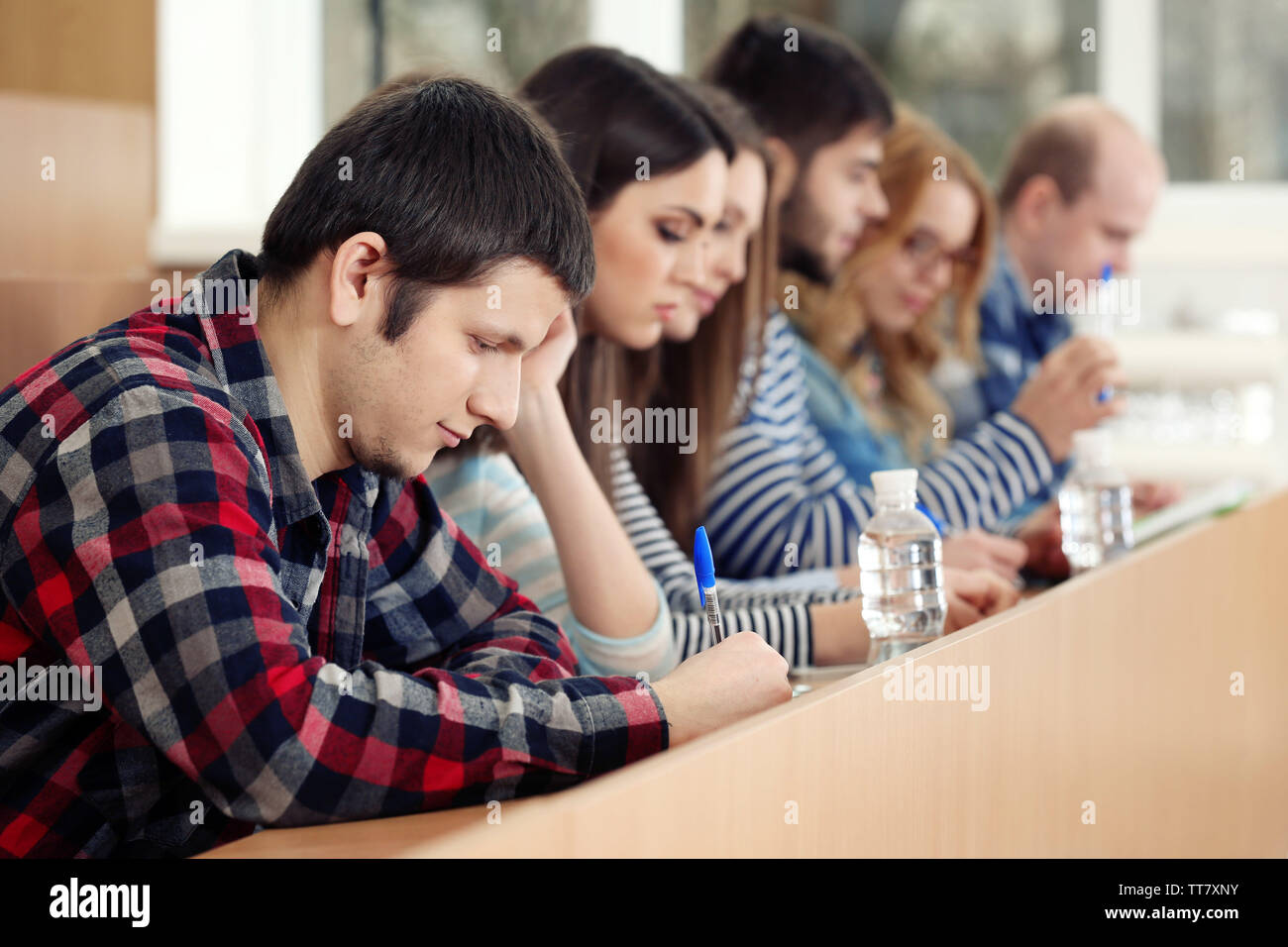 Group of students sitting in classroom Stock Photo - Alamy