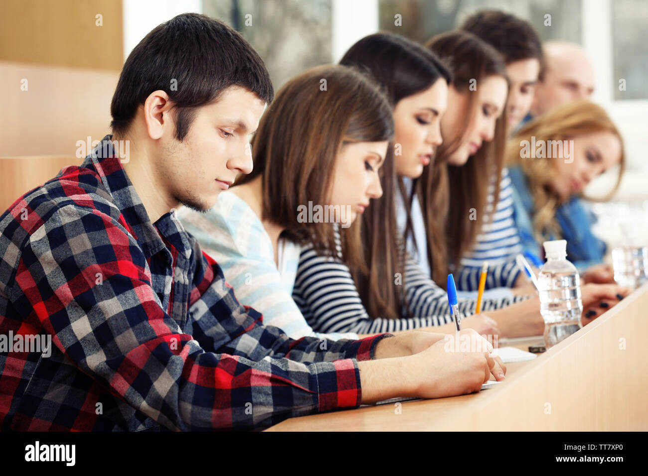 Group of students sitting in classroom Stock Photo - Alamy