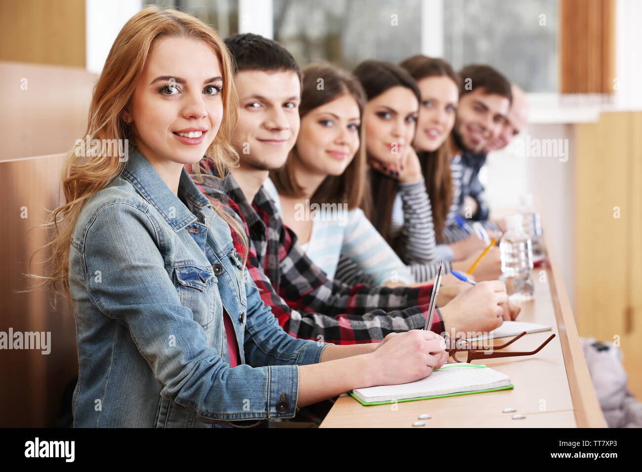Group of students sitting in classroom Stock Photo - Alamy