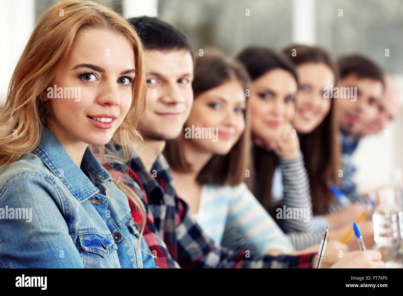 Group of students sitting in classroom Stock Photo - Alamy