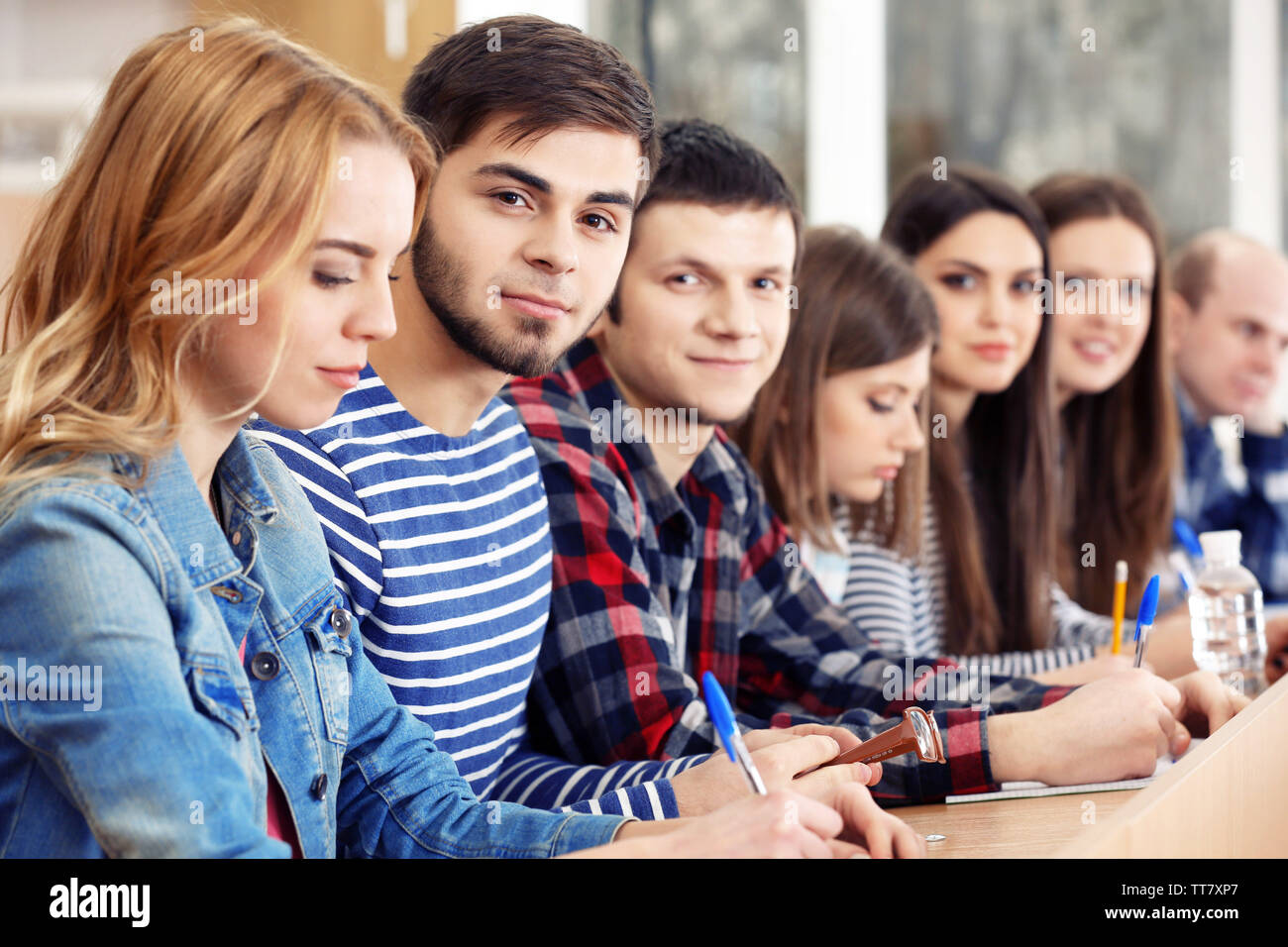 Group of students sitting in classroom Stock Photo - Alamy