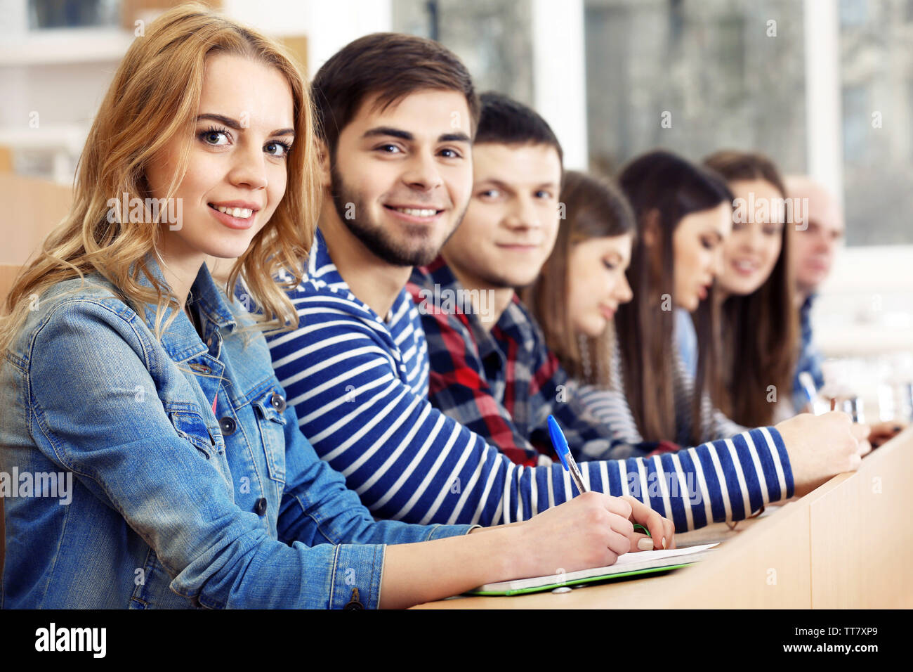 Group of students sitting in classroom Stock Photo - Alamy
