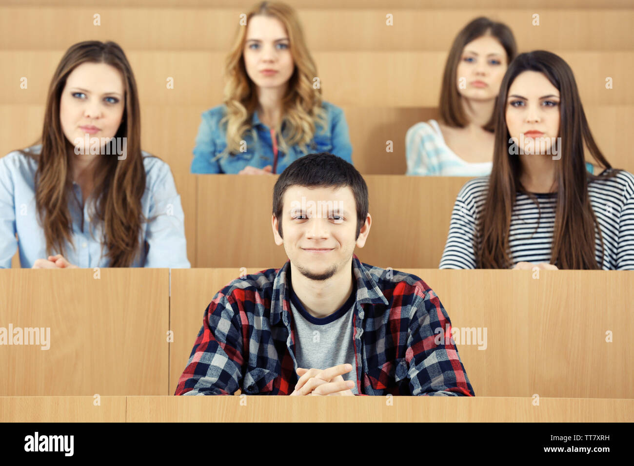 Group of students sitting in classroom Stock Photo - Alamy