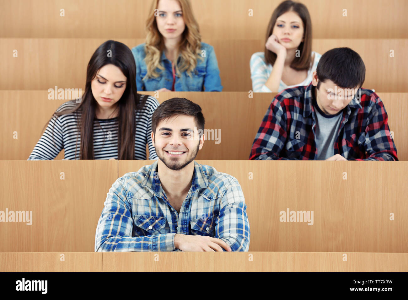 Group of students sitting in classroom Stock Photo - Alamy