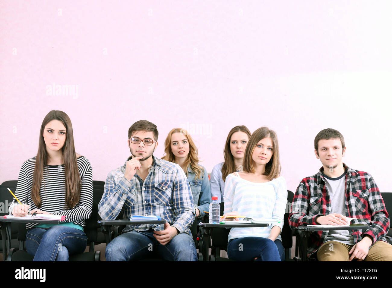 Group of students sitting in classroom Stock Photo - Alamy