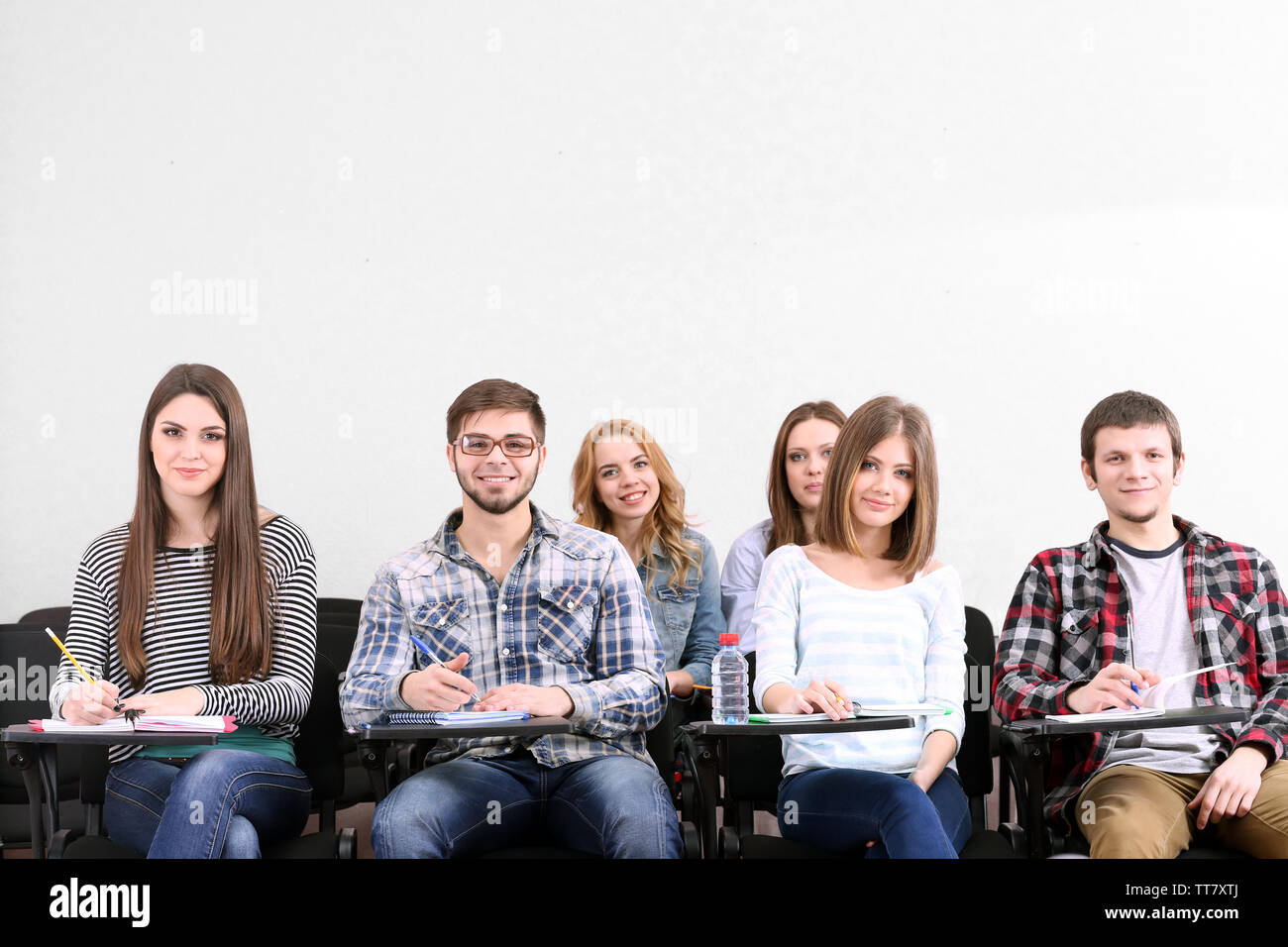 Group of students sitting in classroom Stock Photo - Alamy