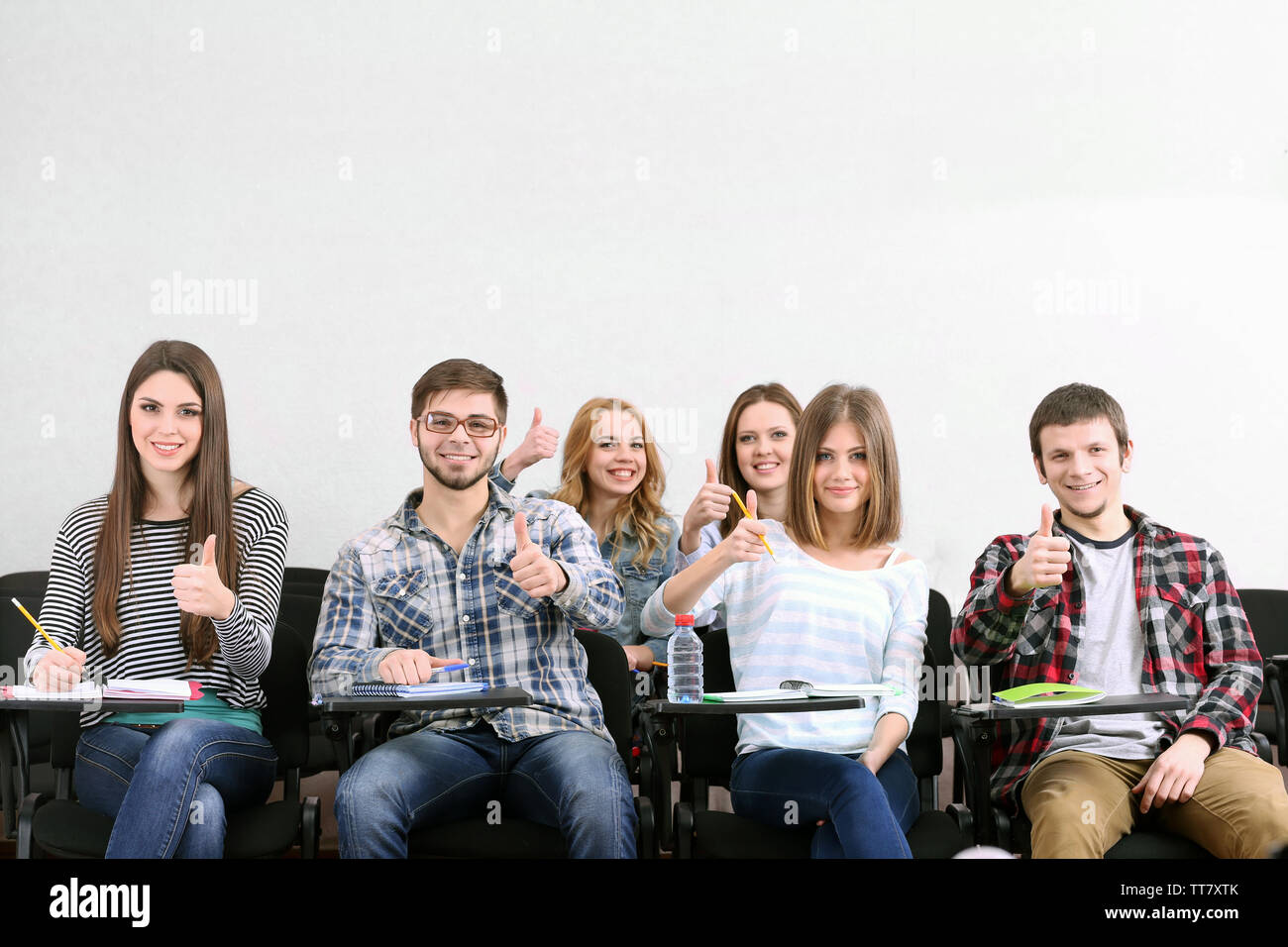 Group of students sitting in classroom Stock Photo - Alamy