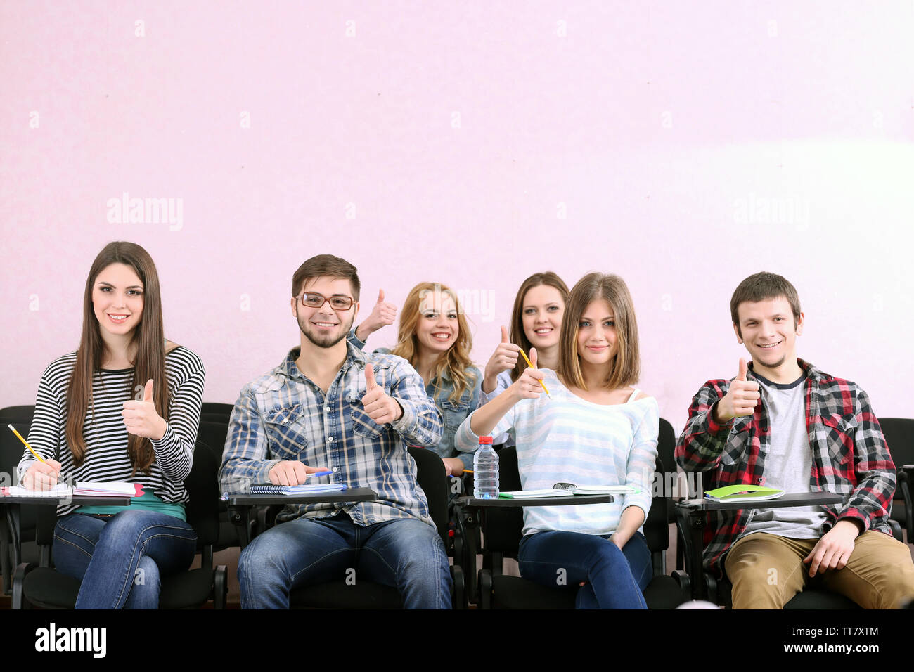 Group of students sitting in classroom Stock Photo - Alamy