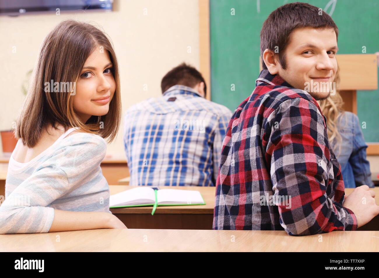 Group of students sitting in classroom Stock Photo - Alamy