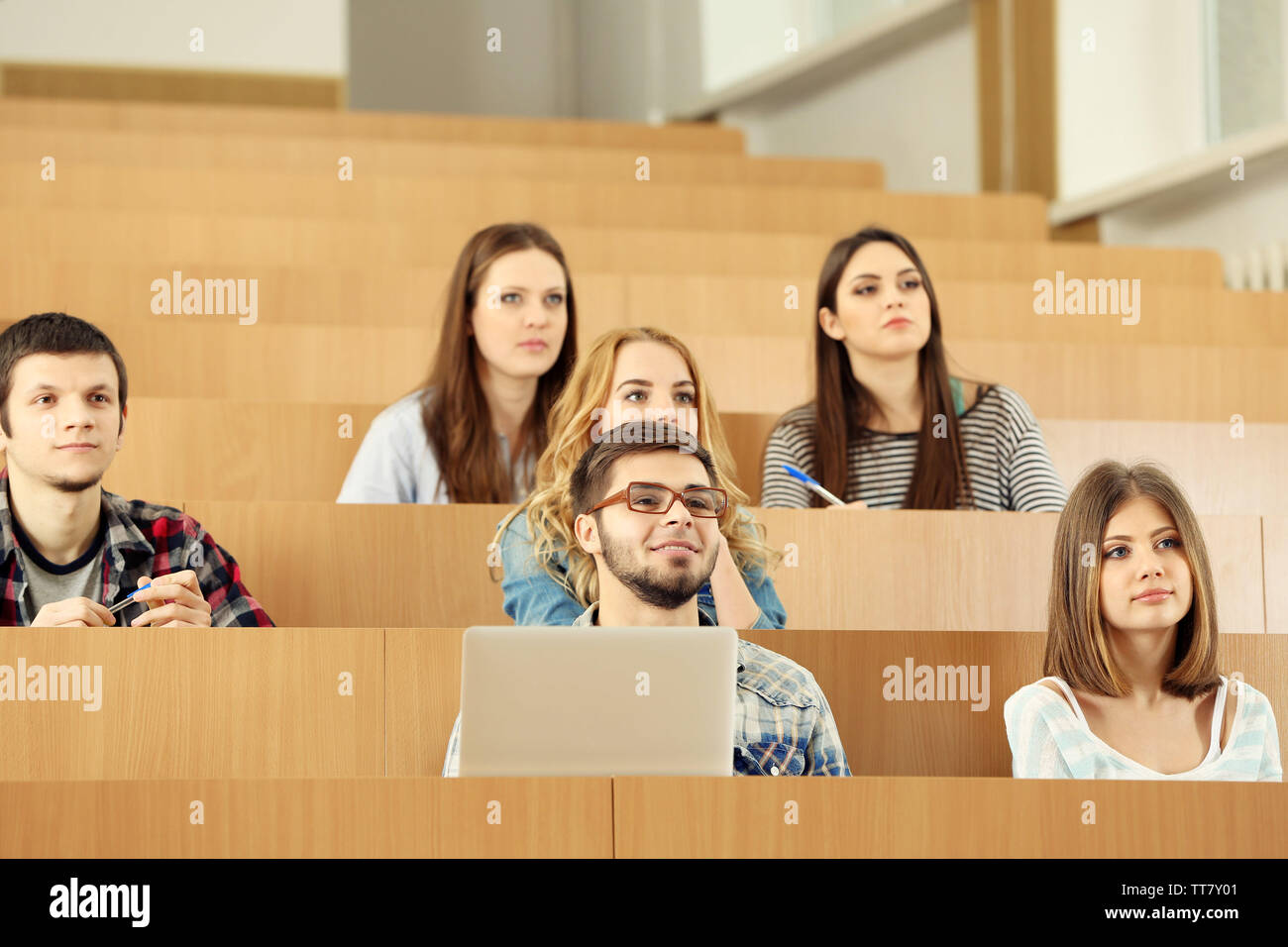 Group of students sitting in classroom Stock Photo - Alamy