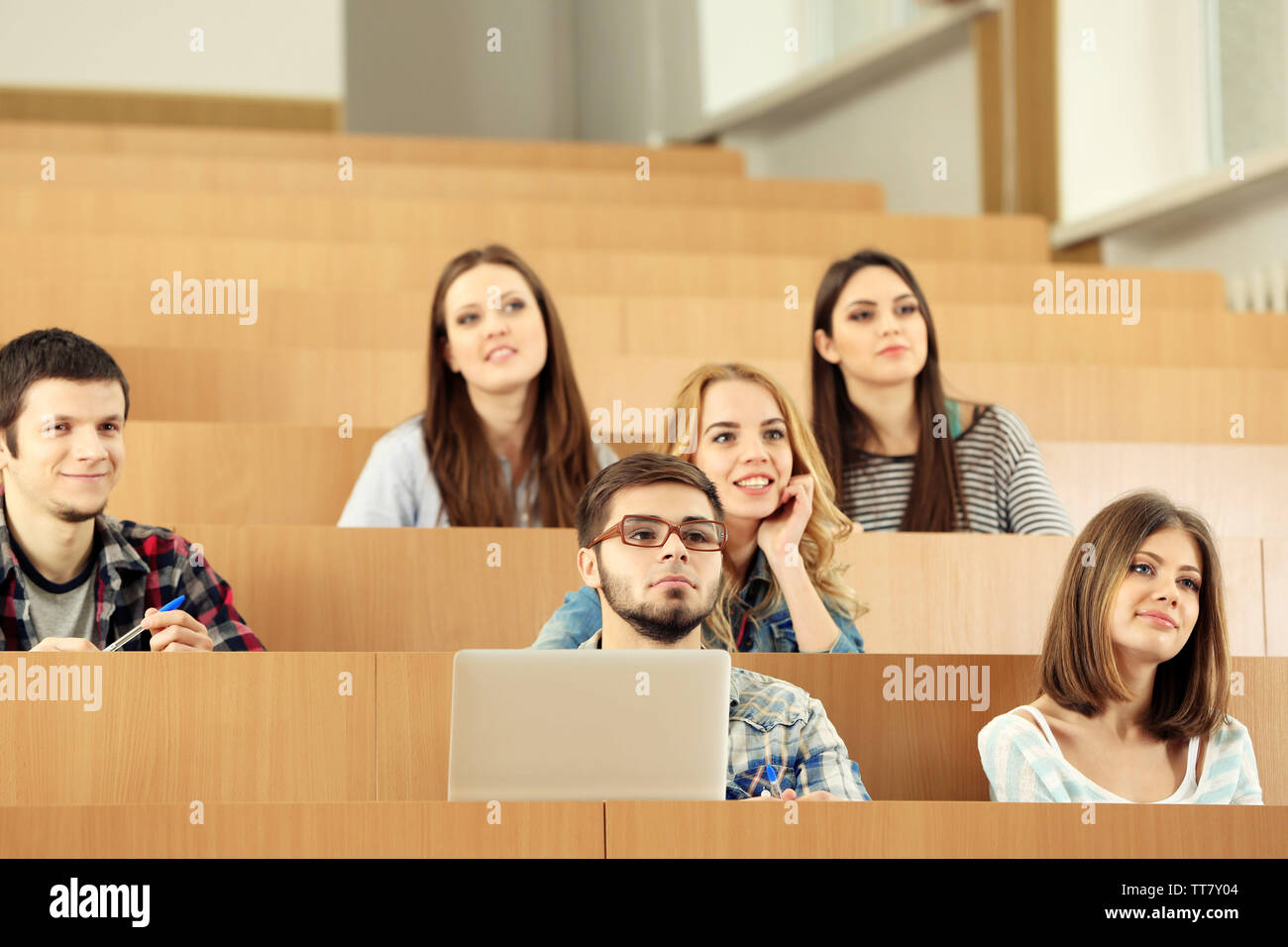 Group of students sitting in classroom Stock Photo - Alamy