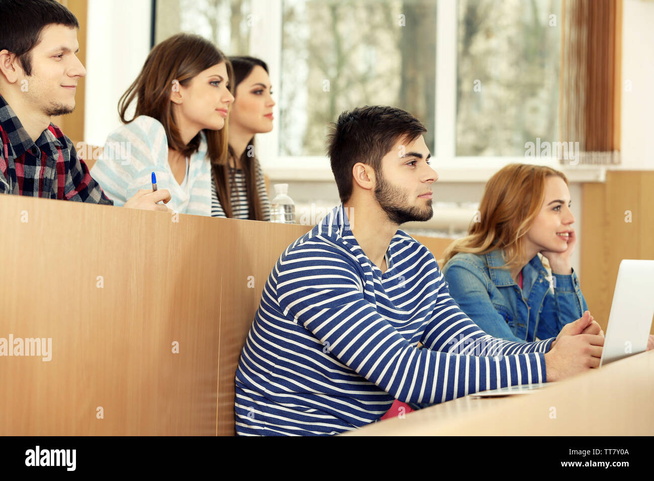 Group of students sitting in classroom Stock Photo - Alamy