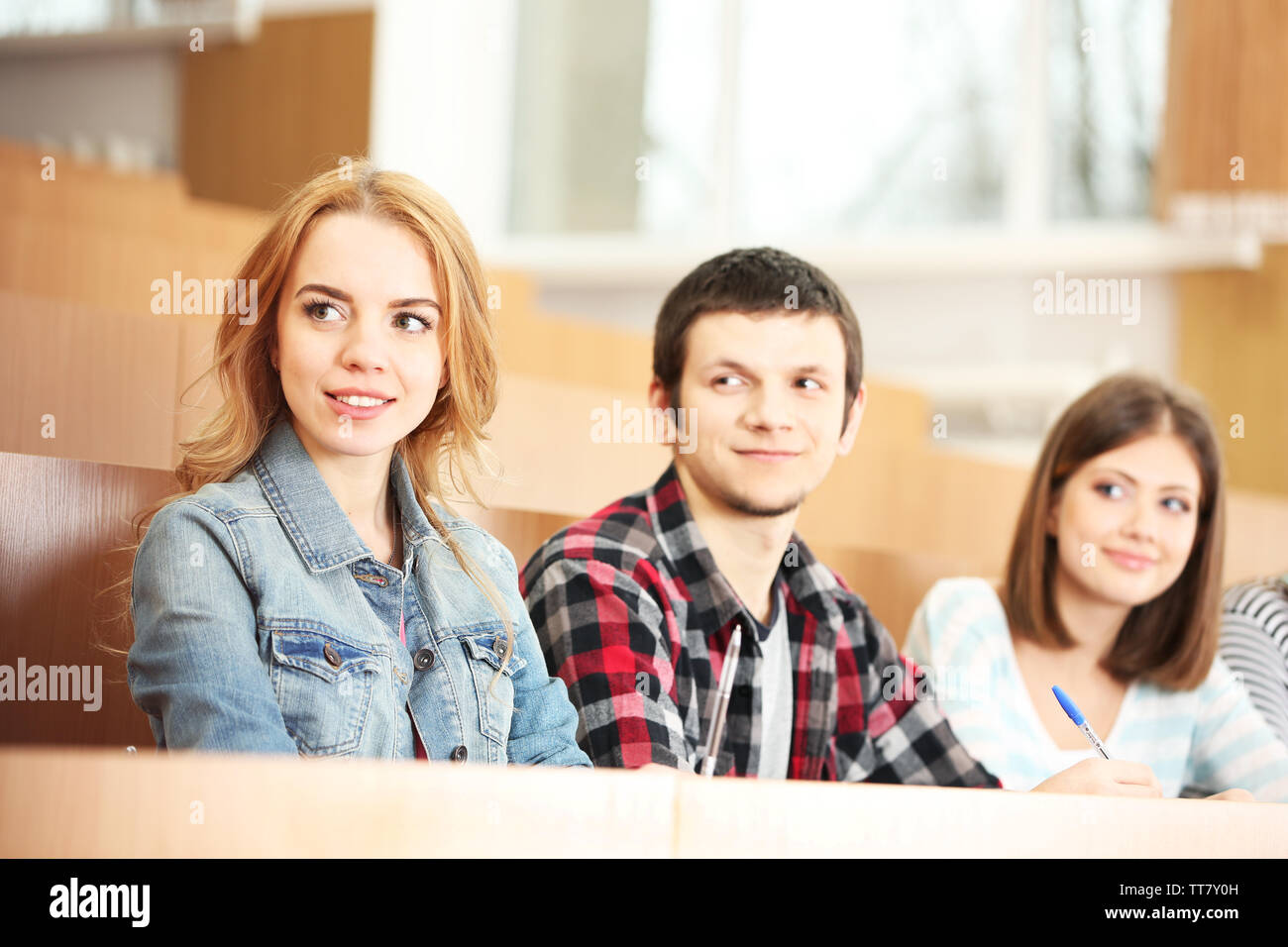 Group of students sitting in classroom Stock Photo - Alamy
