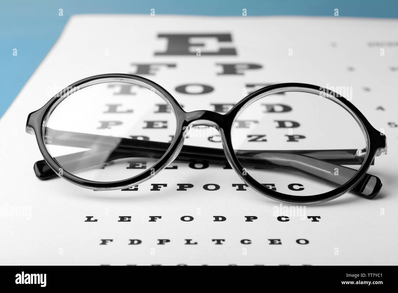 Glasses on eye chart close-up Stock Photo - Alamy