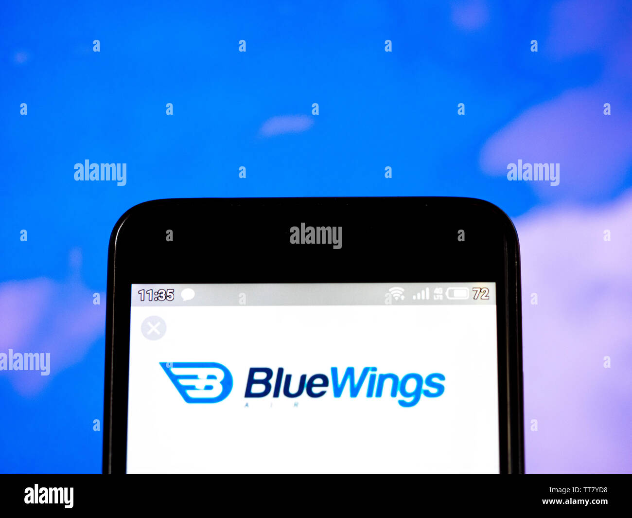 In this photo illustration the Blue Wing Airlines logo is seen ...