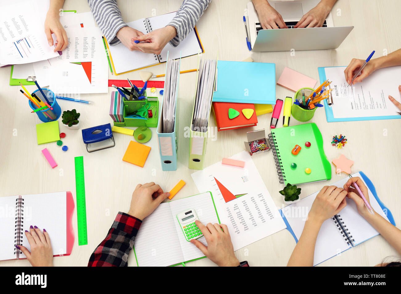Group of people working at desk top view Stock Photo - Alamy