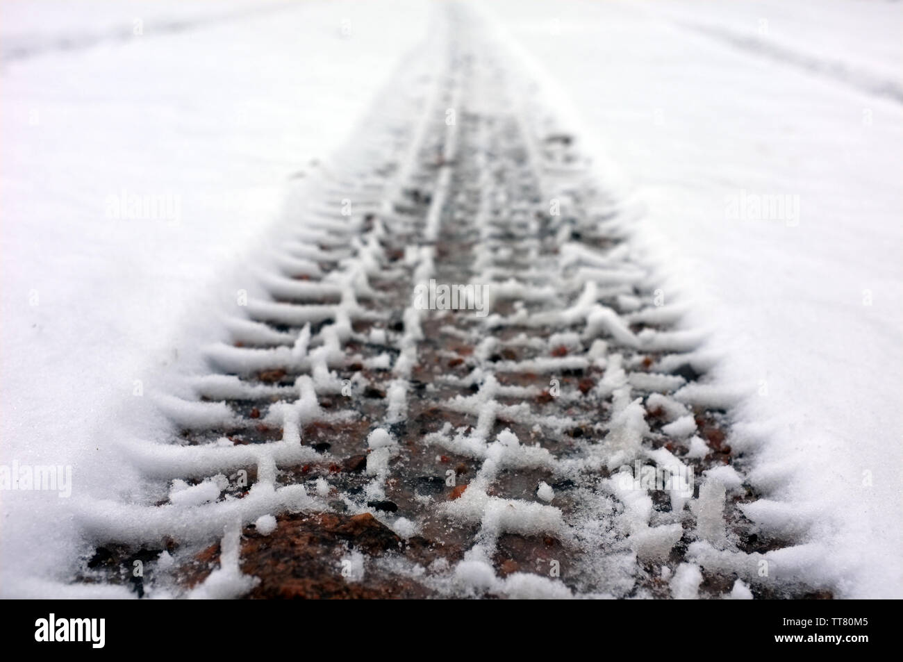 Wheel tire tracks in snow Stock Photo - Alamy