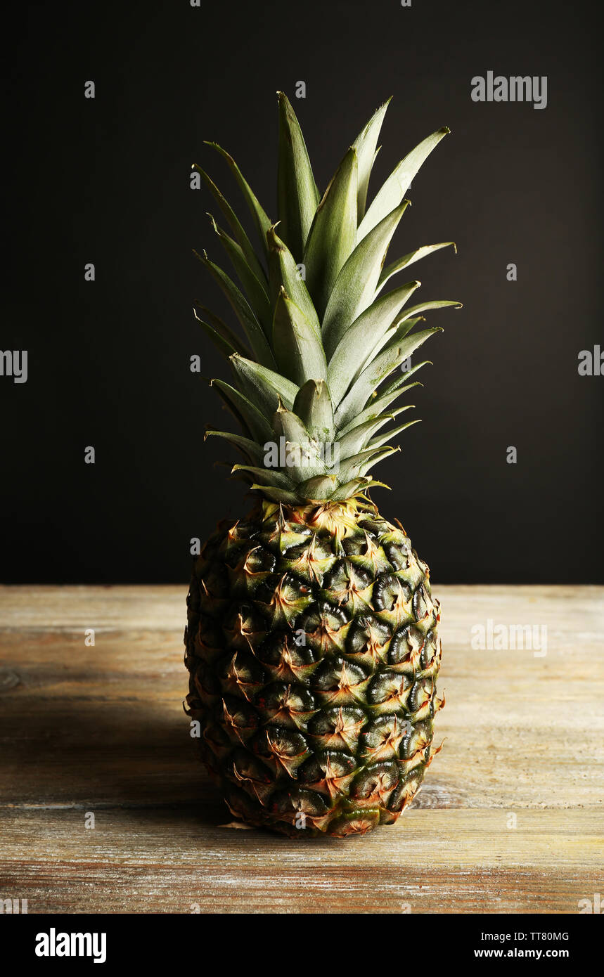 Pineapple on dark background Stock Photo - Alamy